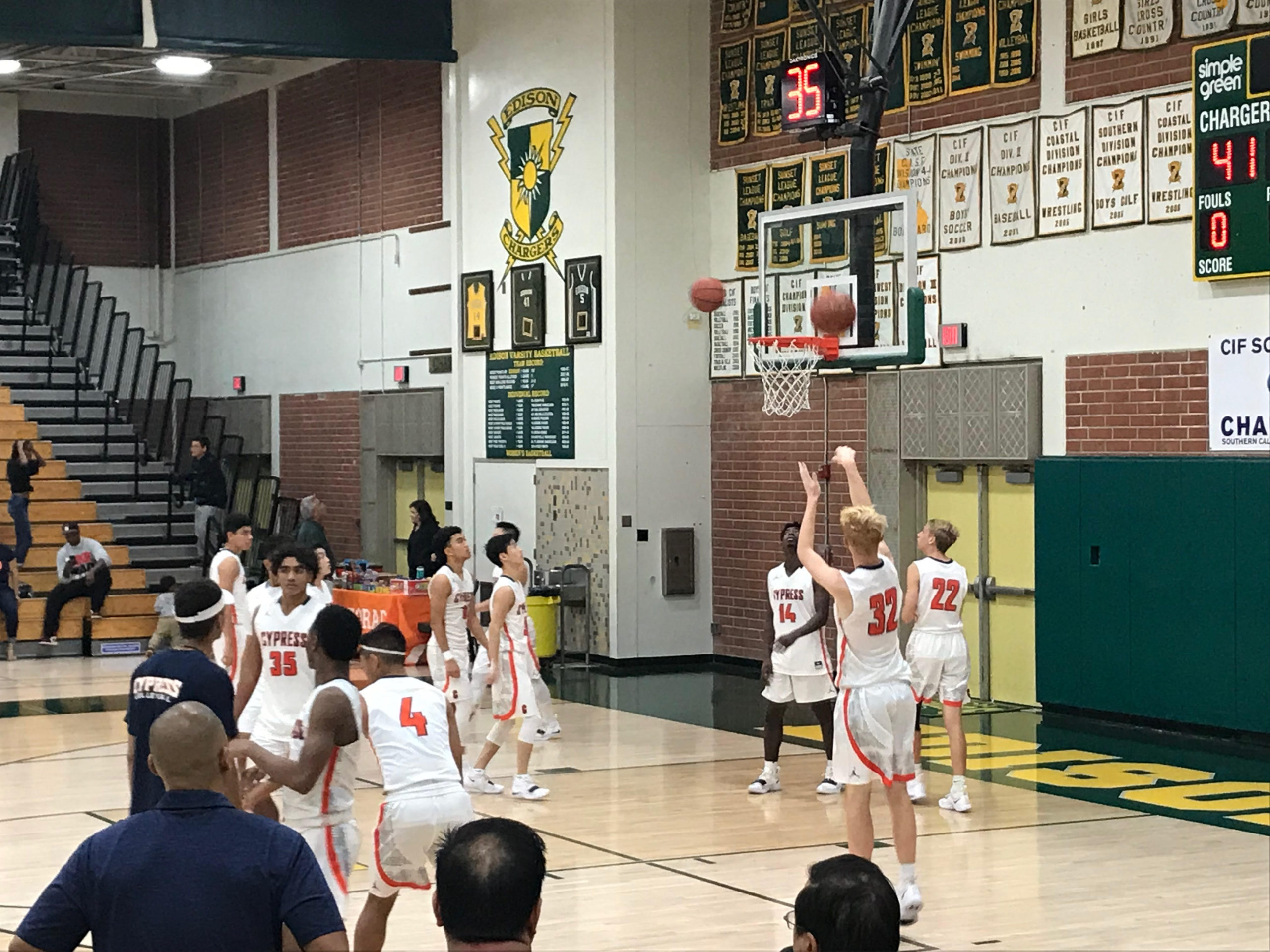 Cypress boys basketball team battles back and captures 68-66 victory over Heritage Christian at ...